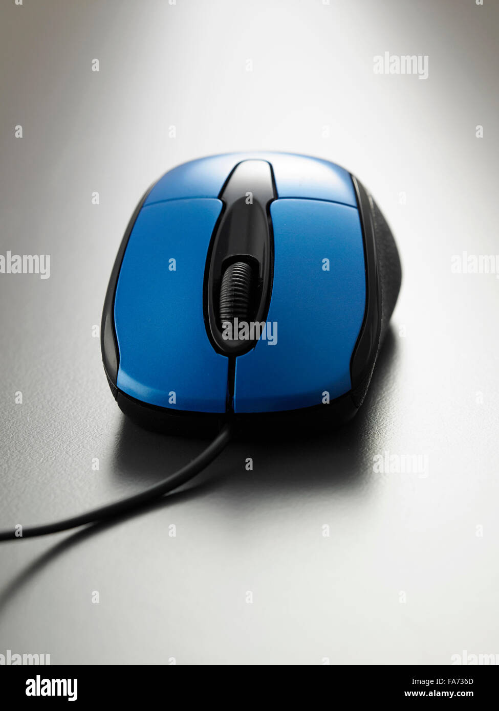 blue color wired mouse on the gray background Stock Photo - Alamy