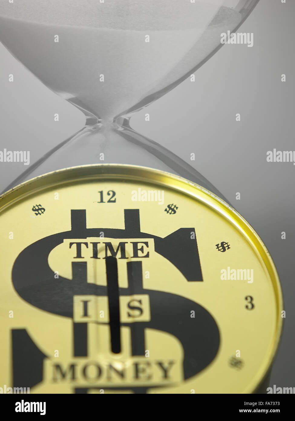 hour glass and the saving can Stock Photo - Alamy