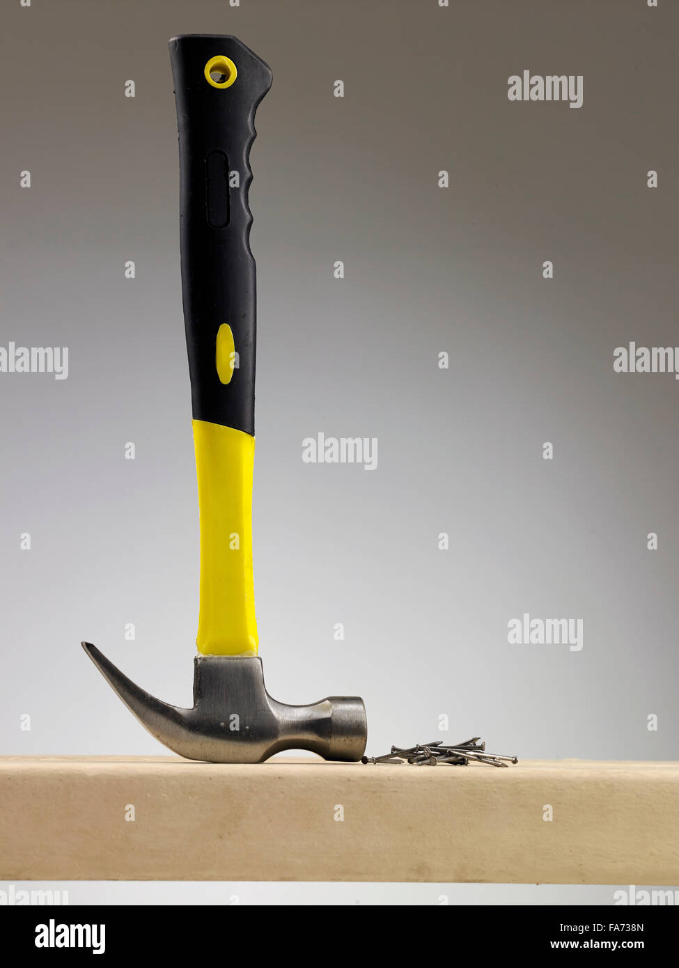 hammer and nail on the rod Stock Photo - Alamy