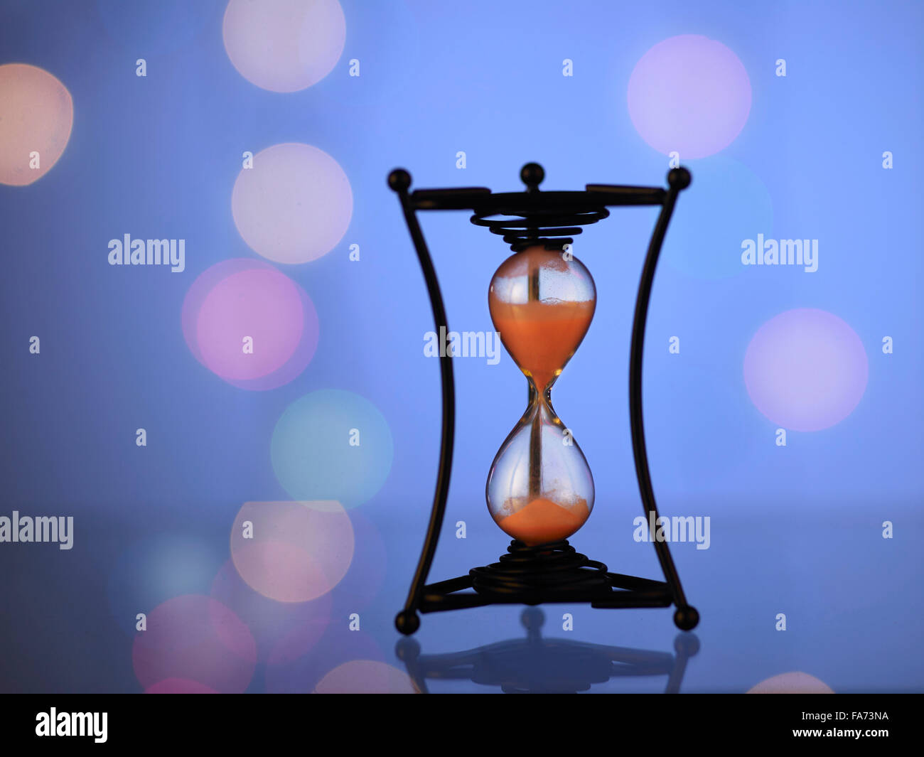 hour glass with beautiful light as background Stock Photo - Alamy