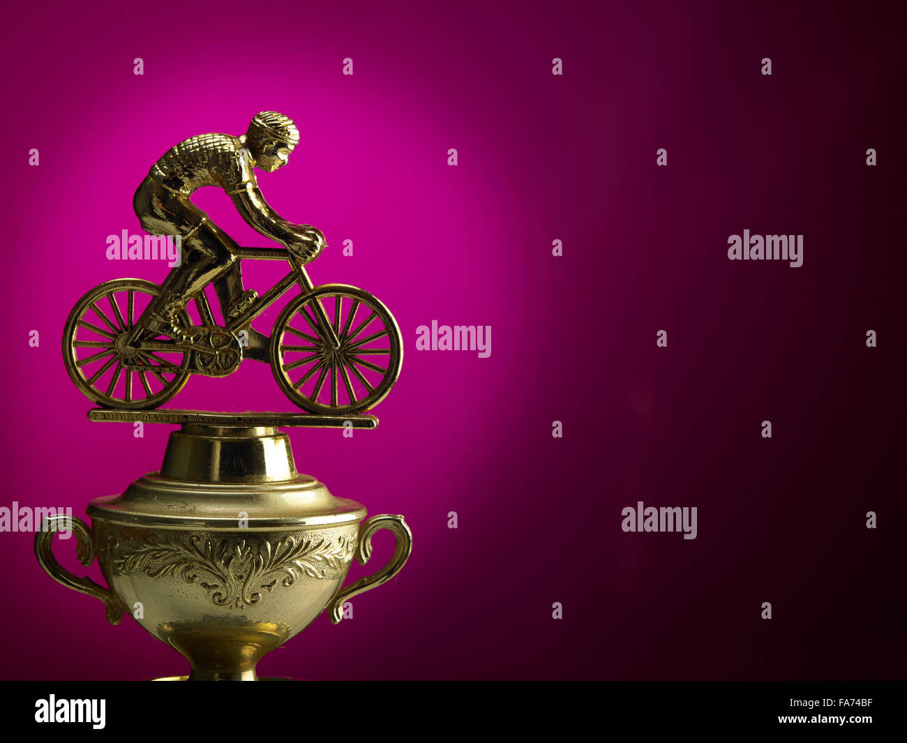 Trophy against the pink glass background Stock Photo - Alamy