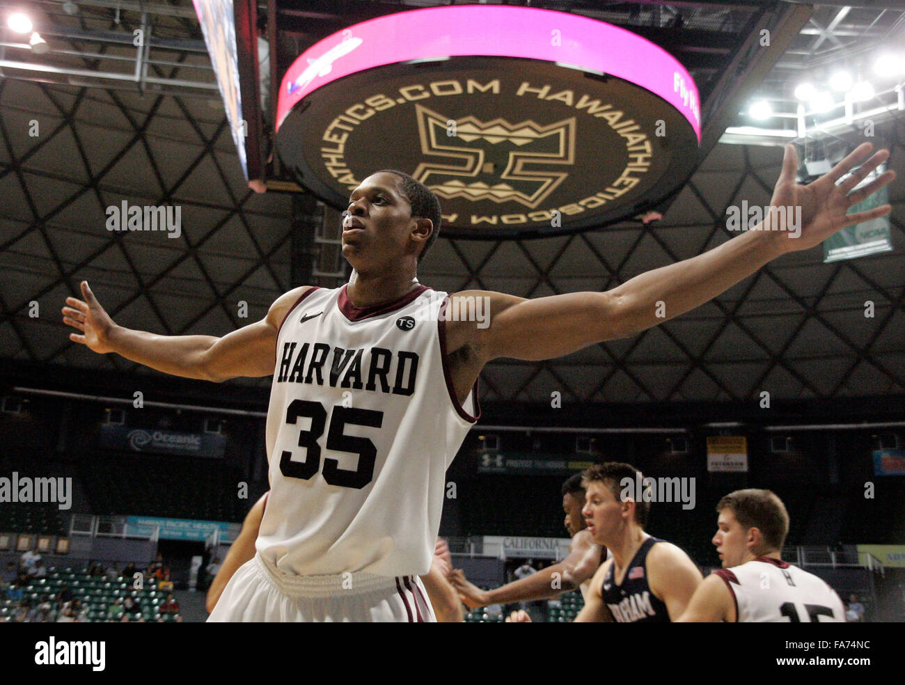 Honolulu, HI, USA. 22nd Dec, 2015. Harvard Crimson guard Agunwa Okolie ...