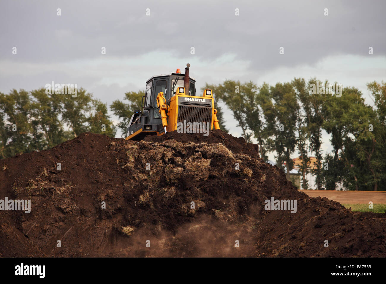 Bulldozer in operation moving dirt and clearing the land Stock Photo ...