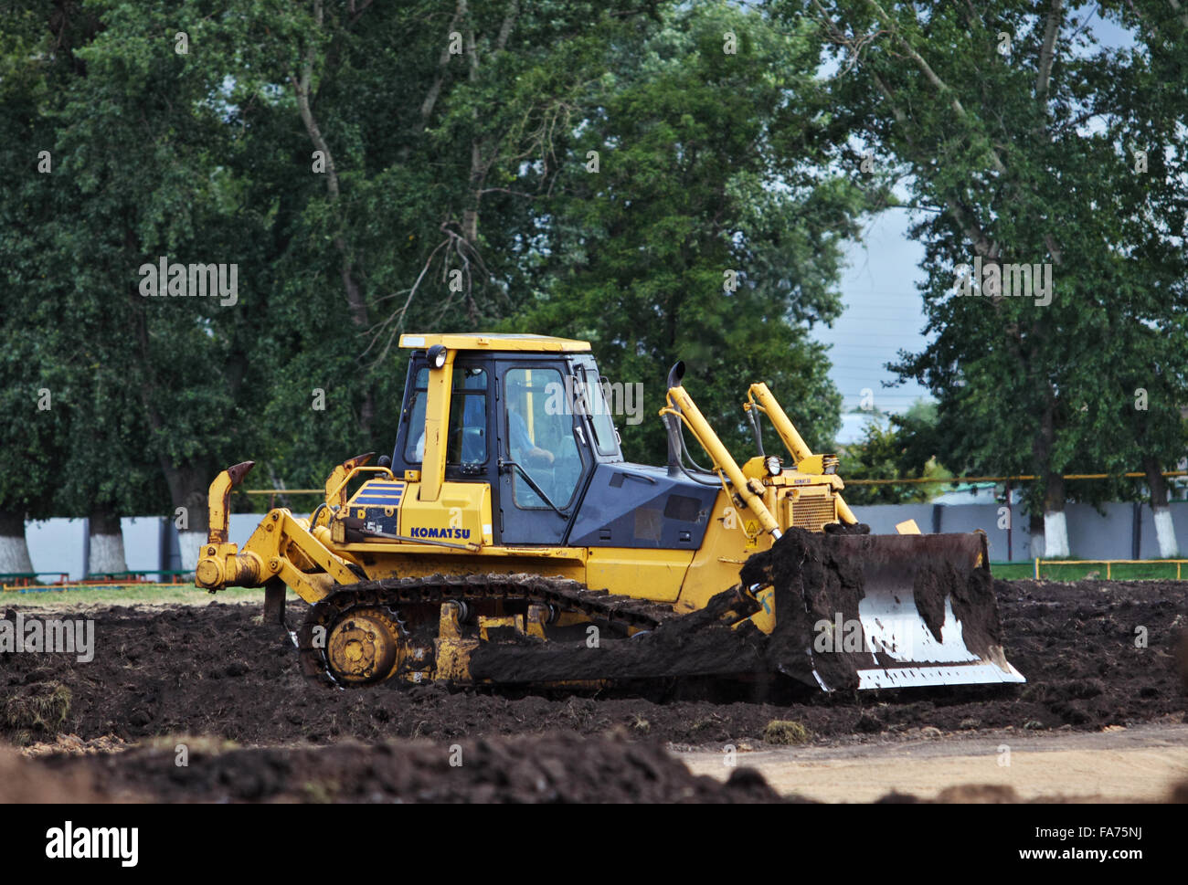 Earthmoving construction equipment moving dirt Stock Photo - Alamy