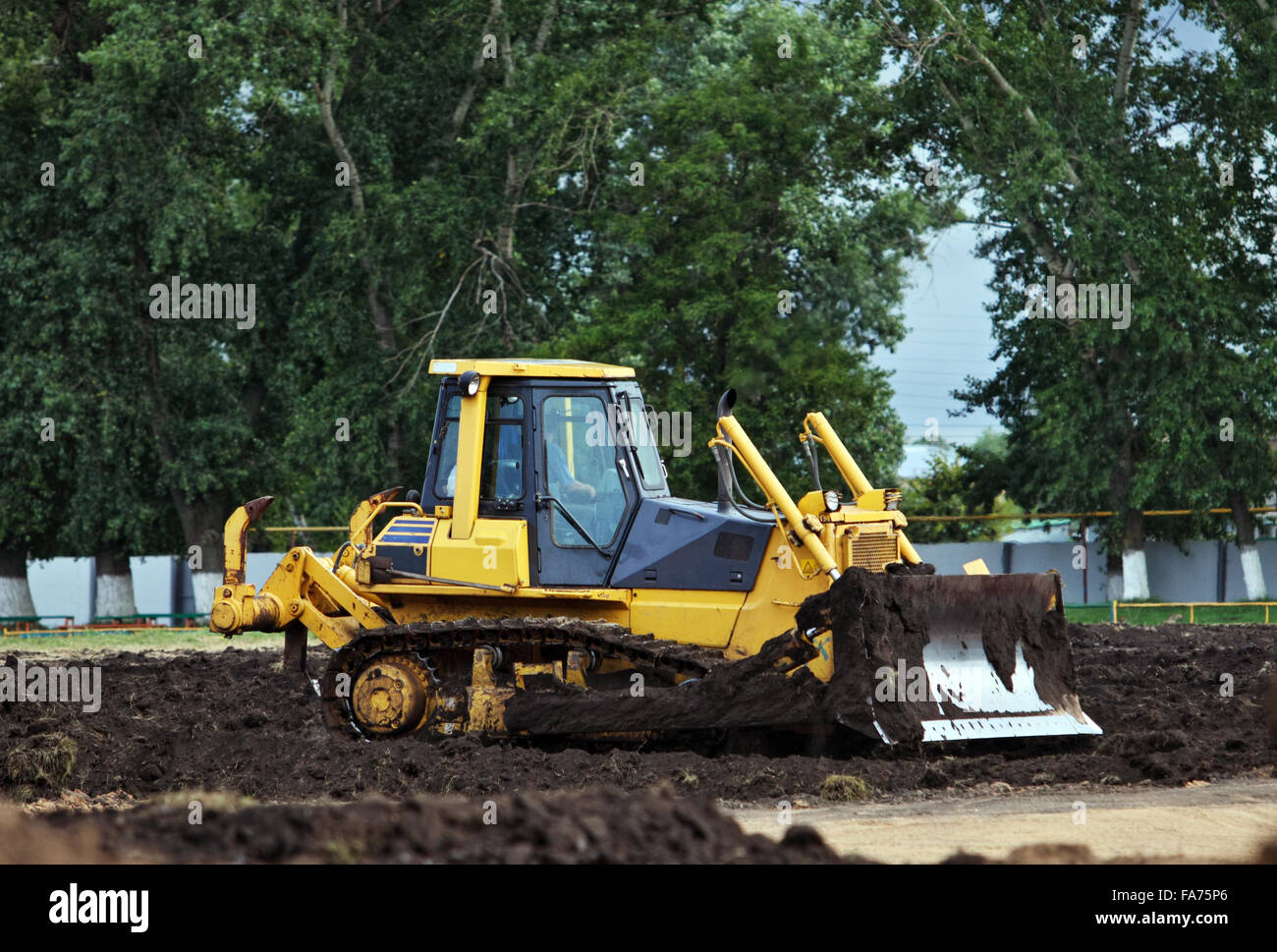Bulldozer at work in Russia road making Stock Photo - Alamy