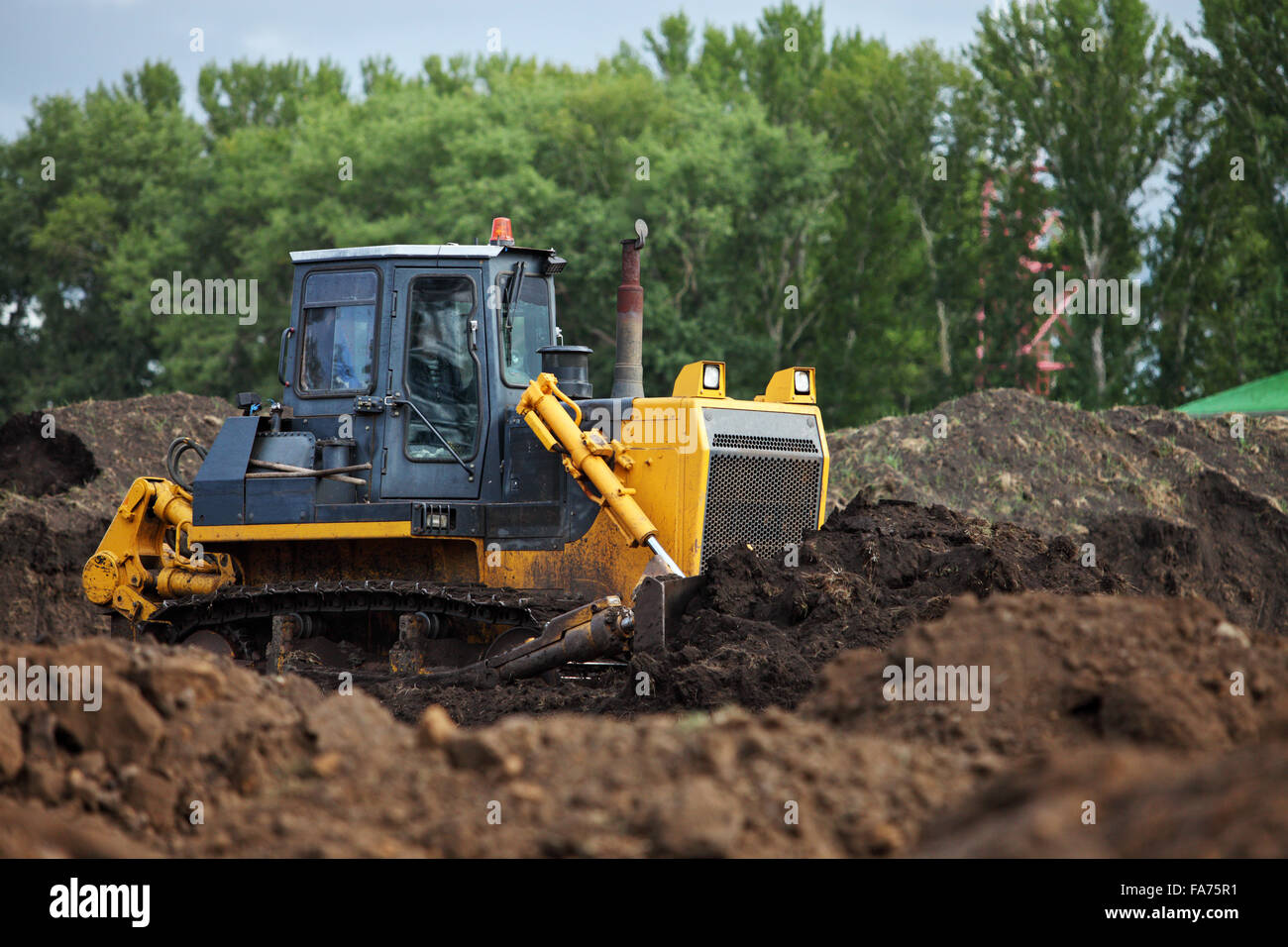 Bulldozer at work in road making Stock Photo - Alamy