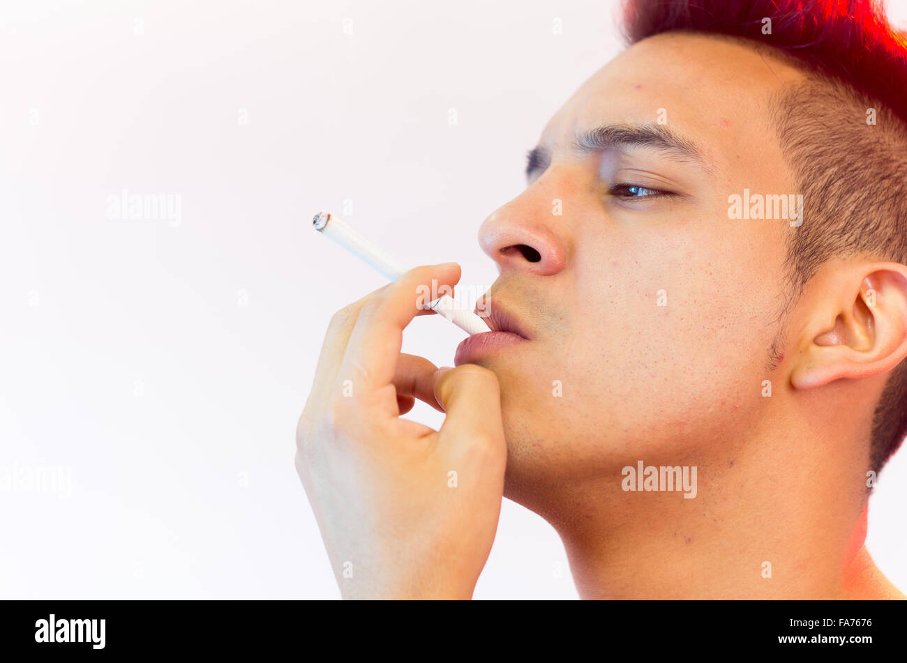Hispanic male headshot posing with serious facial expression and ...