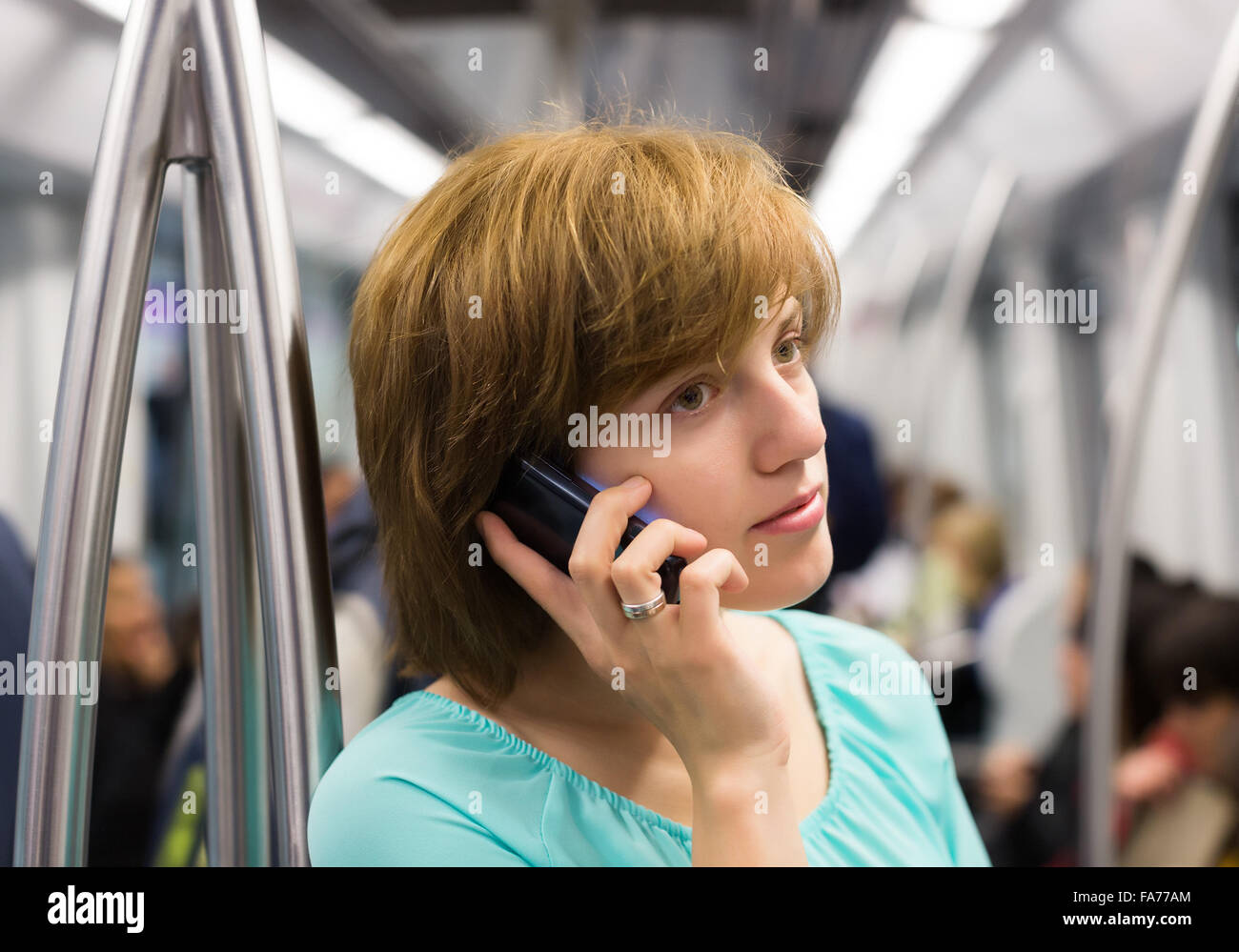 Girl calling by mobile in train Stock Photo - Alamy