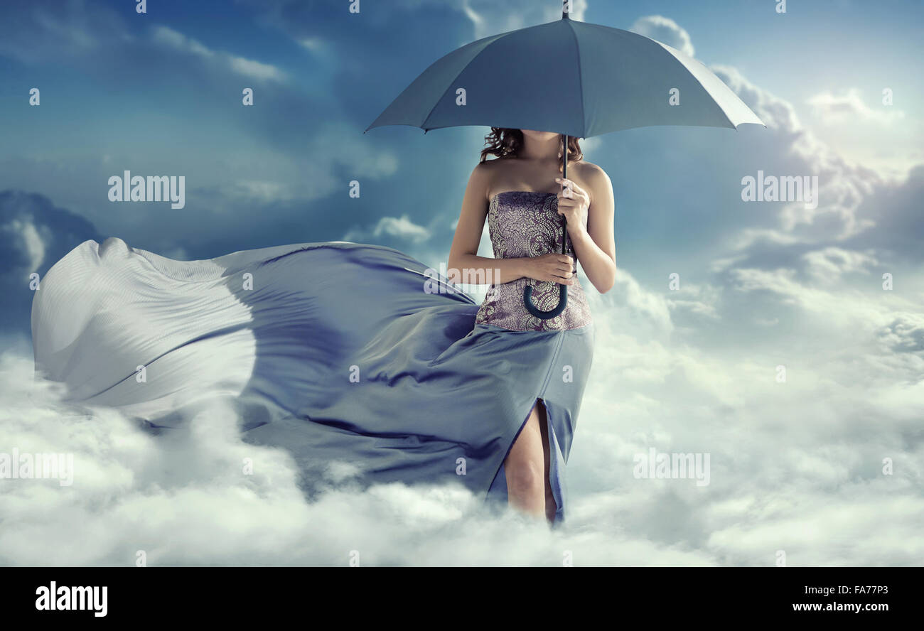 Attractive lady walking on the clouds Stock Photo - Alamy
