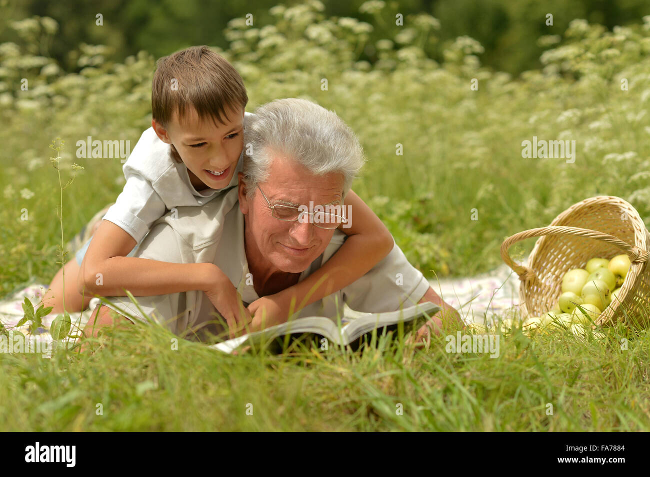 Older boy reading book hi-res stock photography and images - Alamy