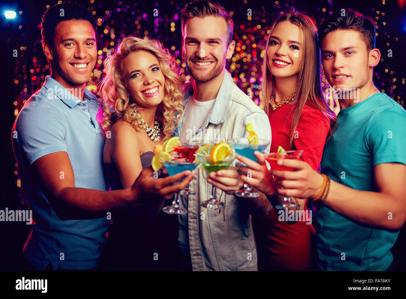 Group of cheerful friends toasting with cocktails at party Stock Photo ...