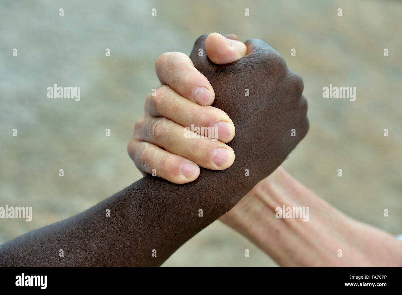Black and white hands held together Stock Photo - Alamy