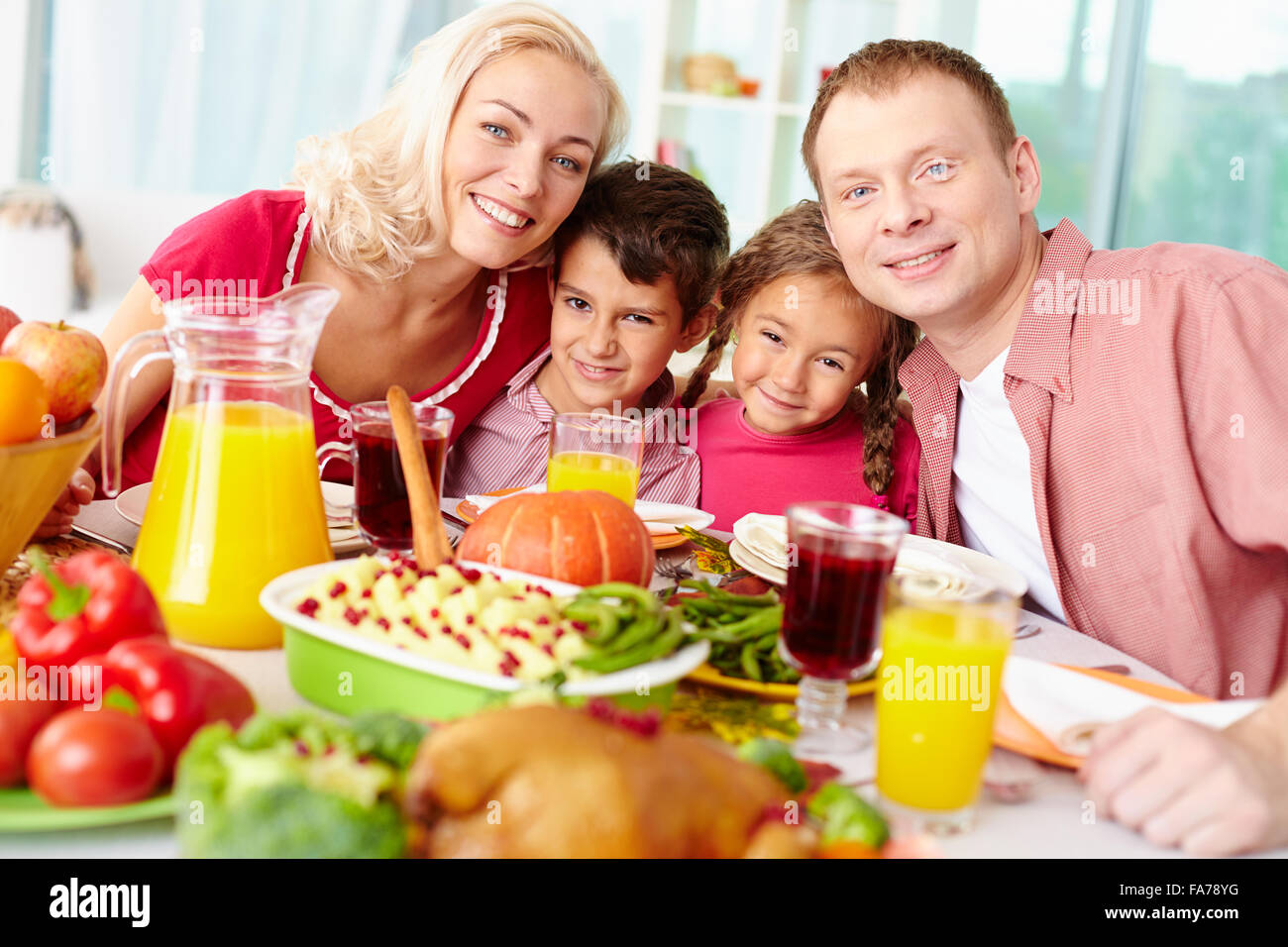 Happy family having dinner together at home Stock Photo - Alamy
