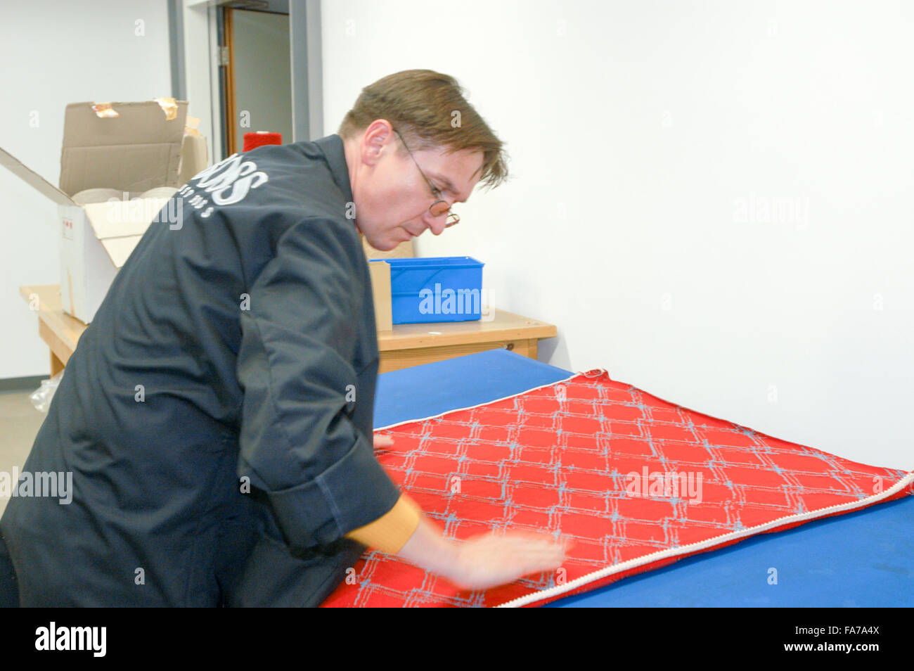 Coldrerio, Switzerland - 21 october 2002: Man working at Hugo Boss ...