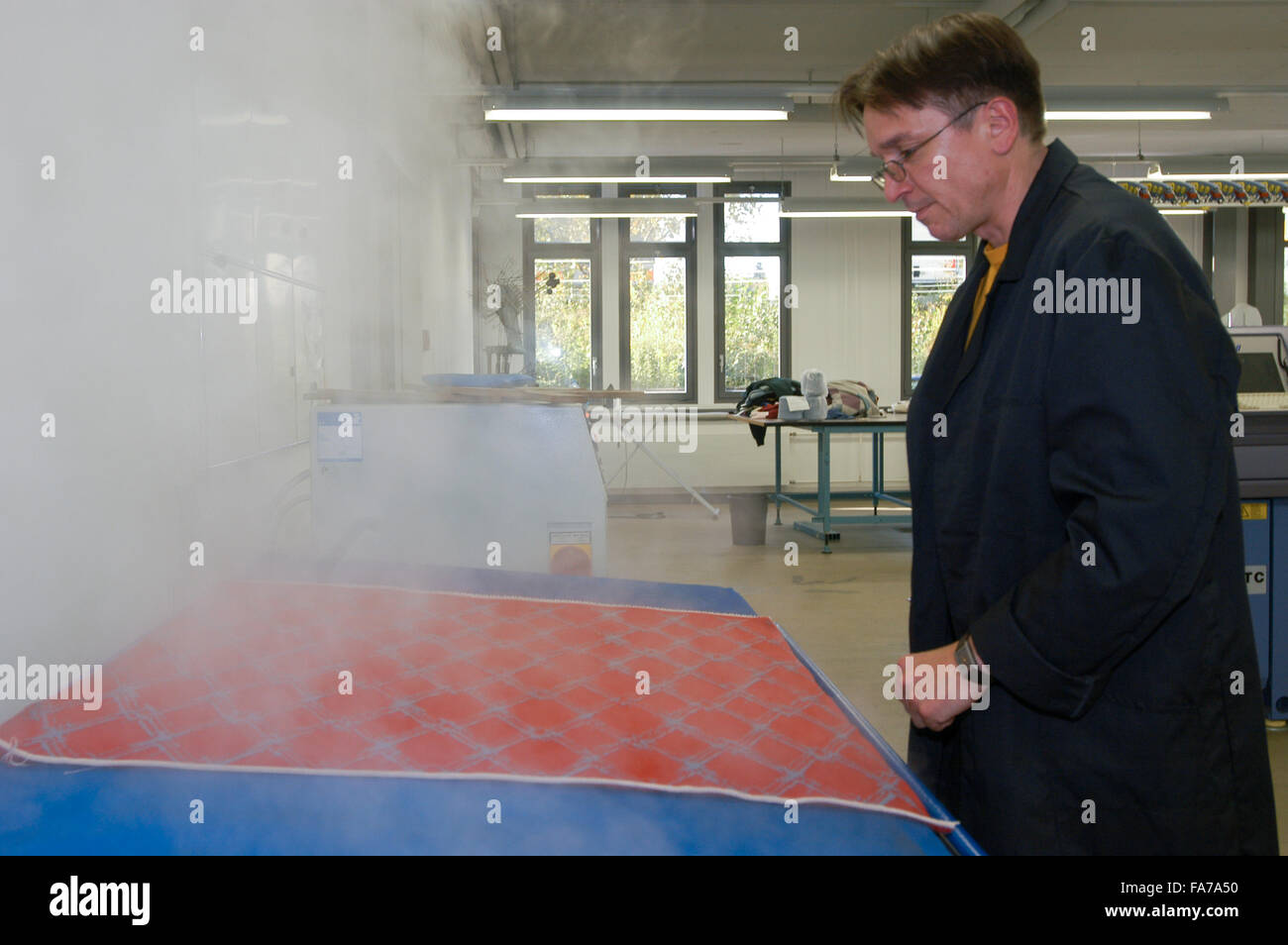 Coldrerio, Switzerland - 21 october 2002: Man working at Hugo Boss ...