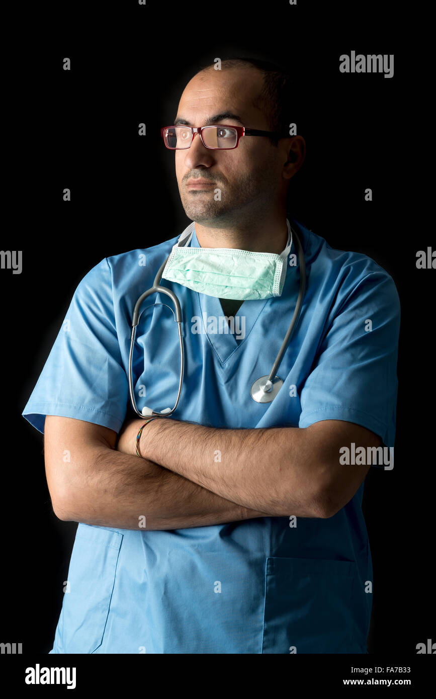 Doctor in uniform in a dark background Stock Photo - Alamy