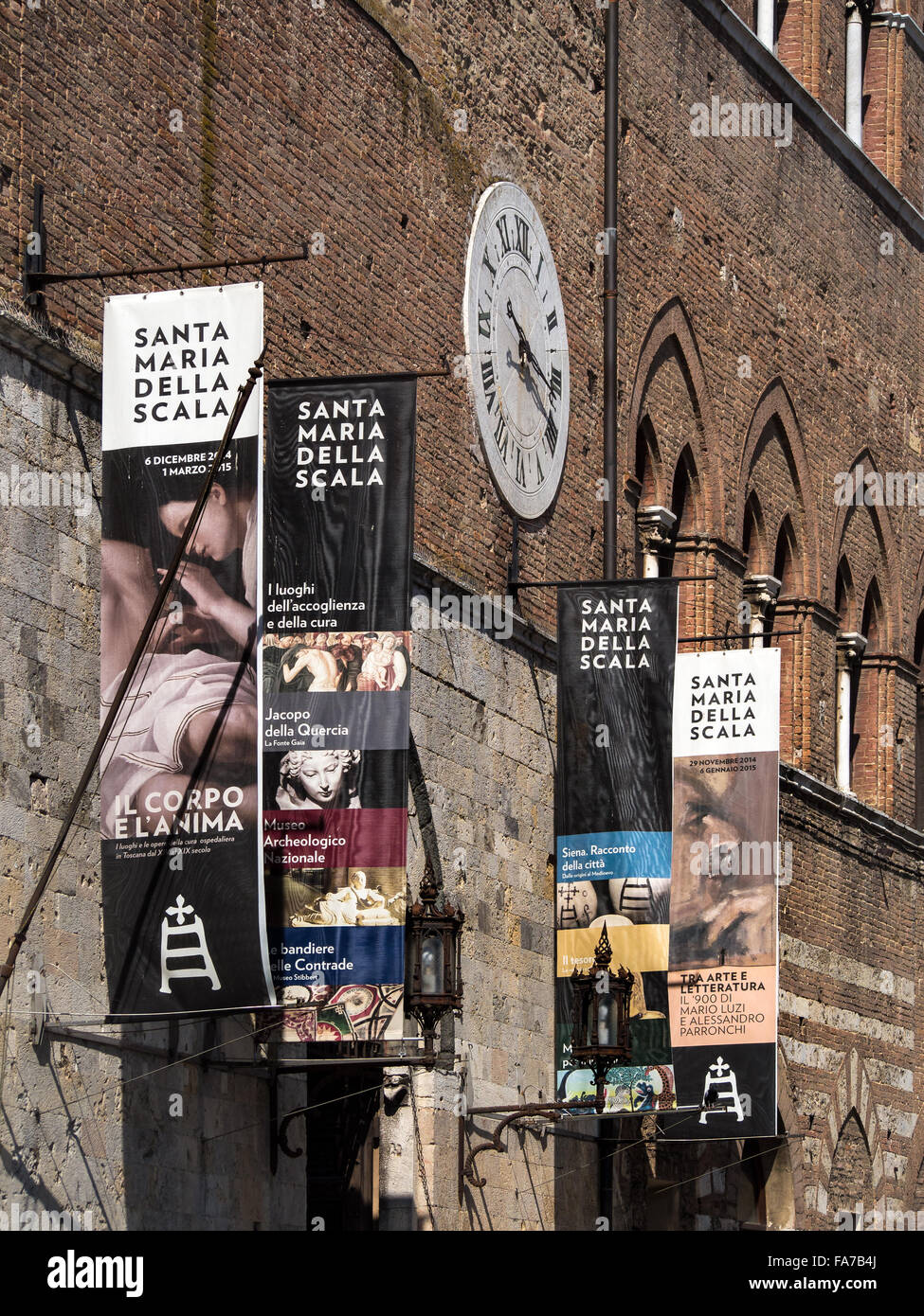 SIENA, ITALY - AUGUST 05, 2015: Banner signs outside the Santa Maria ...