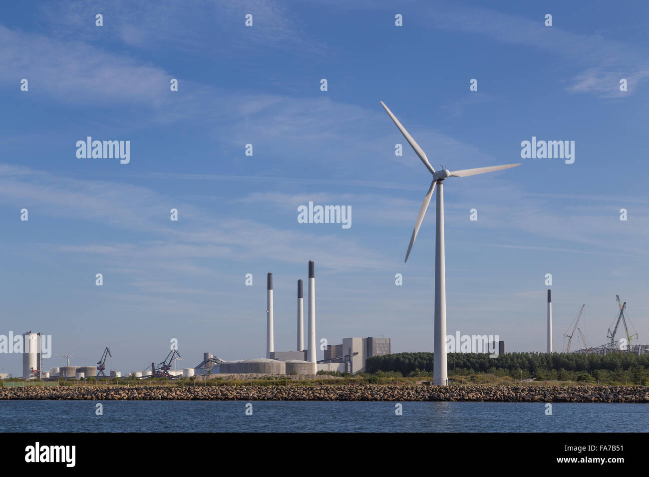 Photograph of wind power plants and industrial buildings in Copenhagen ...