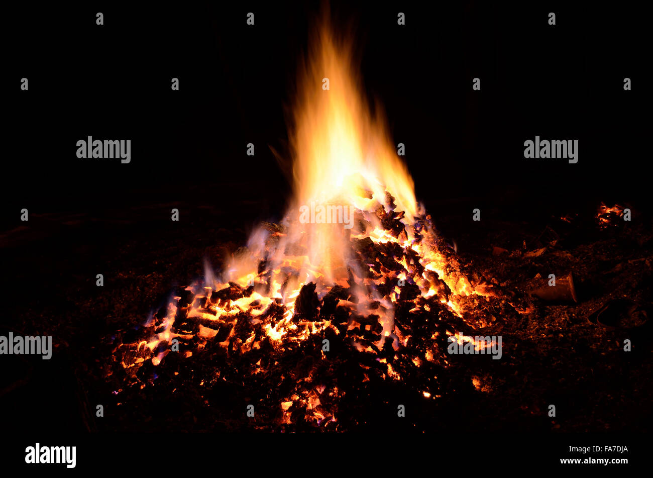 beautiful red hot glowing ember pile with colorful flames in winter ...