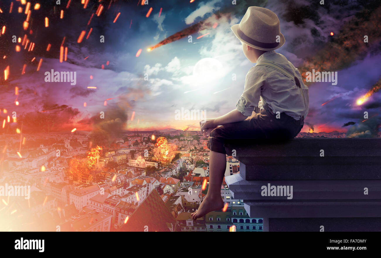 Little boy watching an end of the world Stock Photo - Alamy
