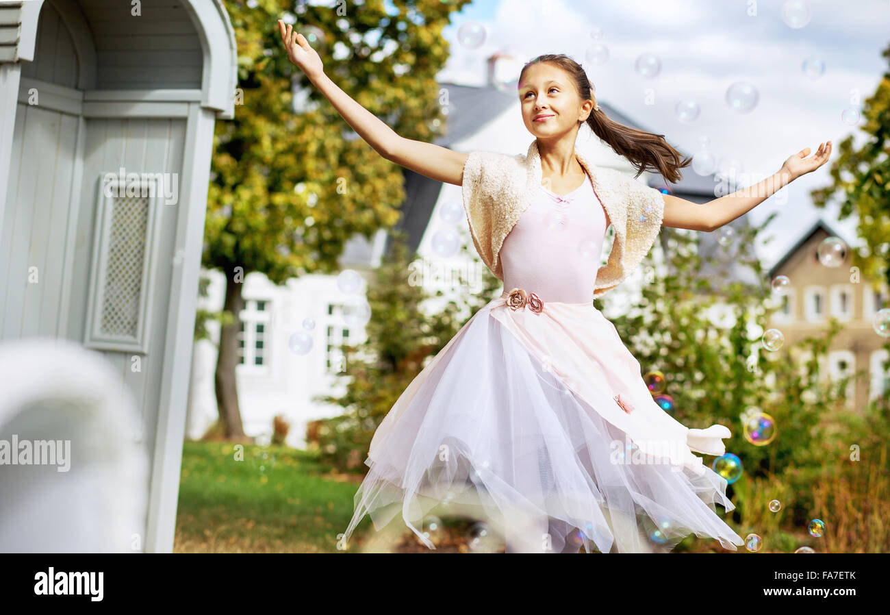 Pretty ballet dancer dancing among the soap bubbles Stock Photo - Alamy