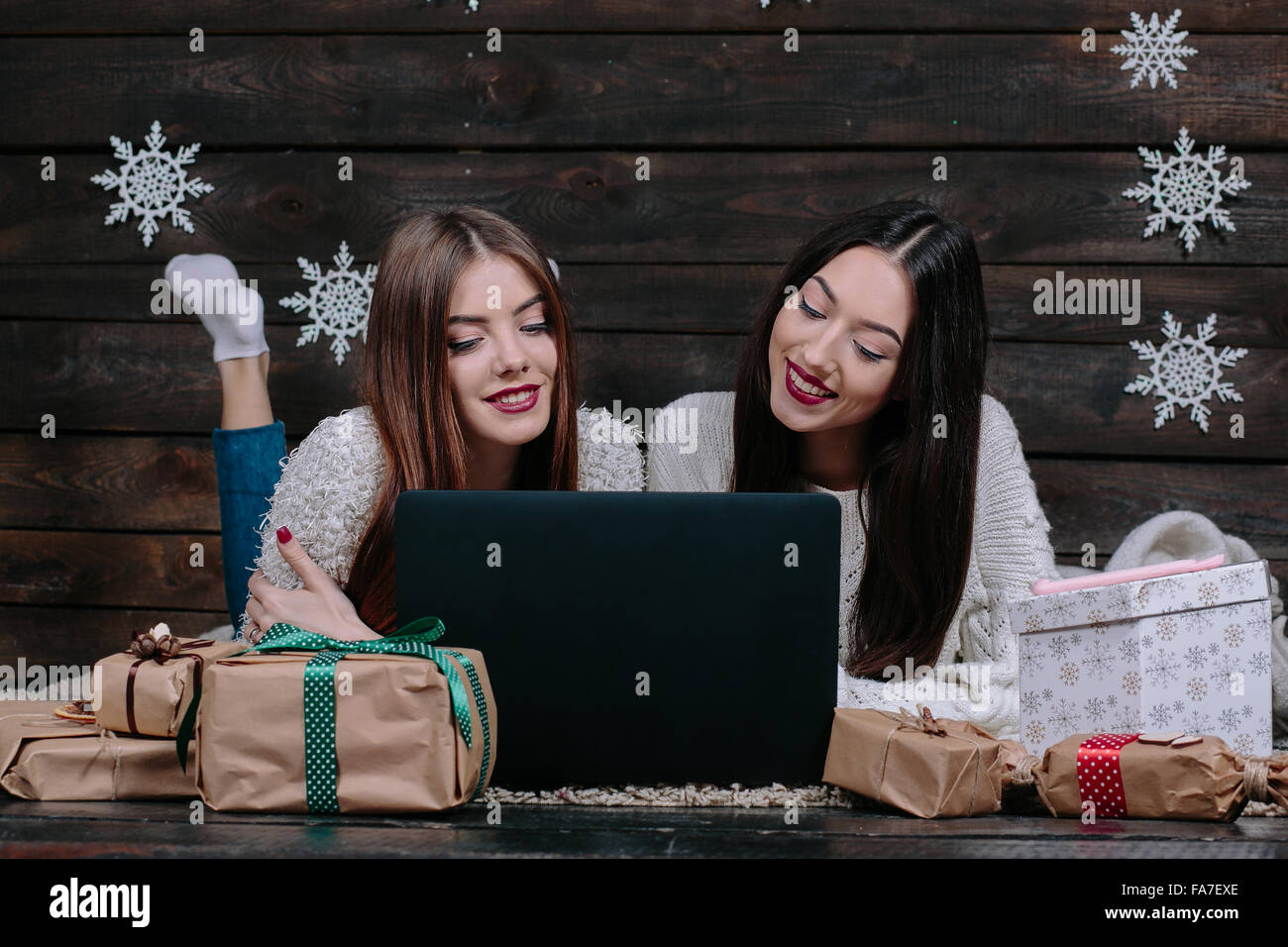 Two beautiful girls lie on the floor Stock Photo - Alamy
