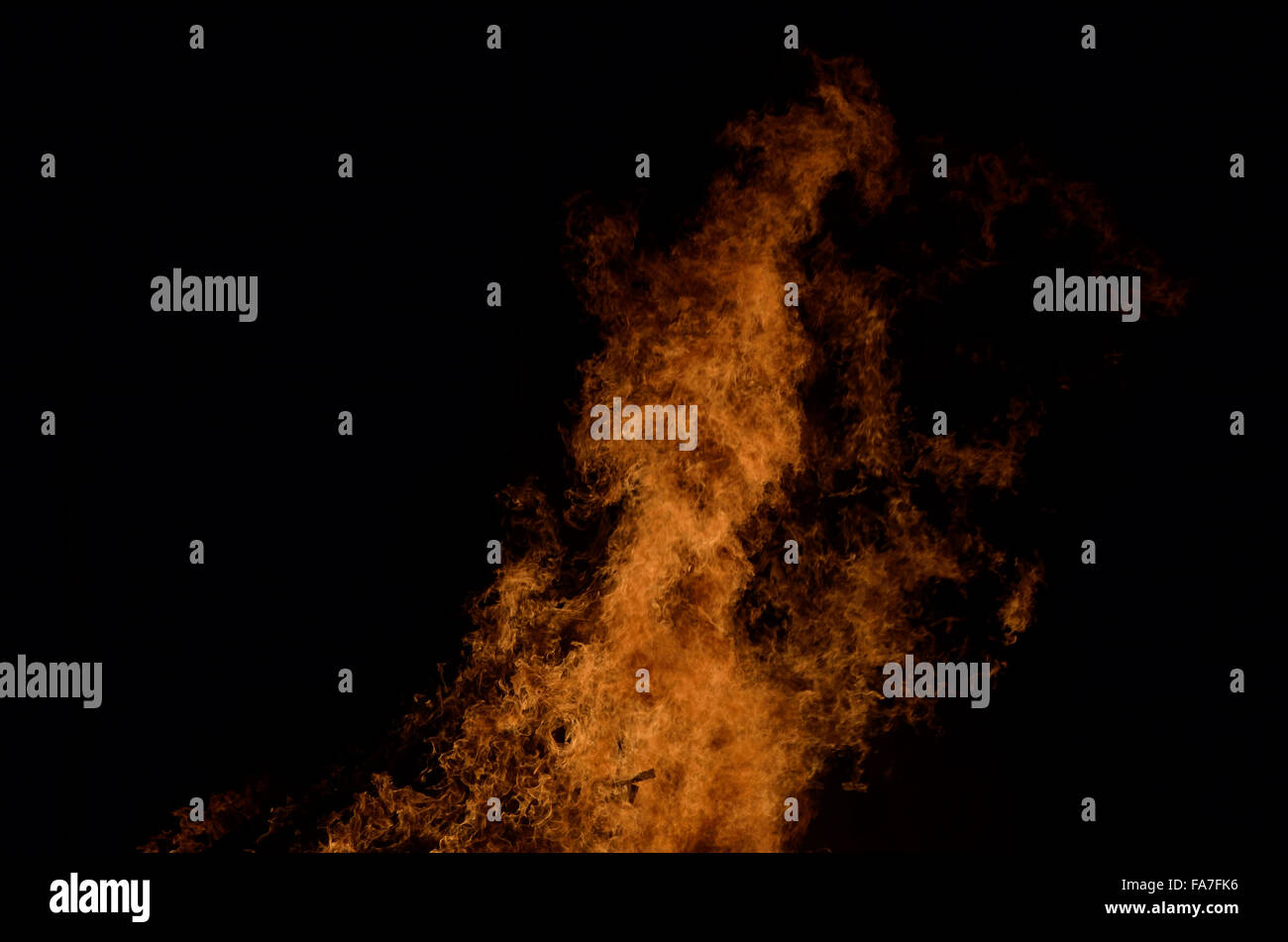 beautiful hot burning tall flames from bonfire on dark winter ...