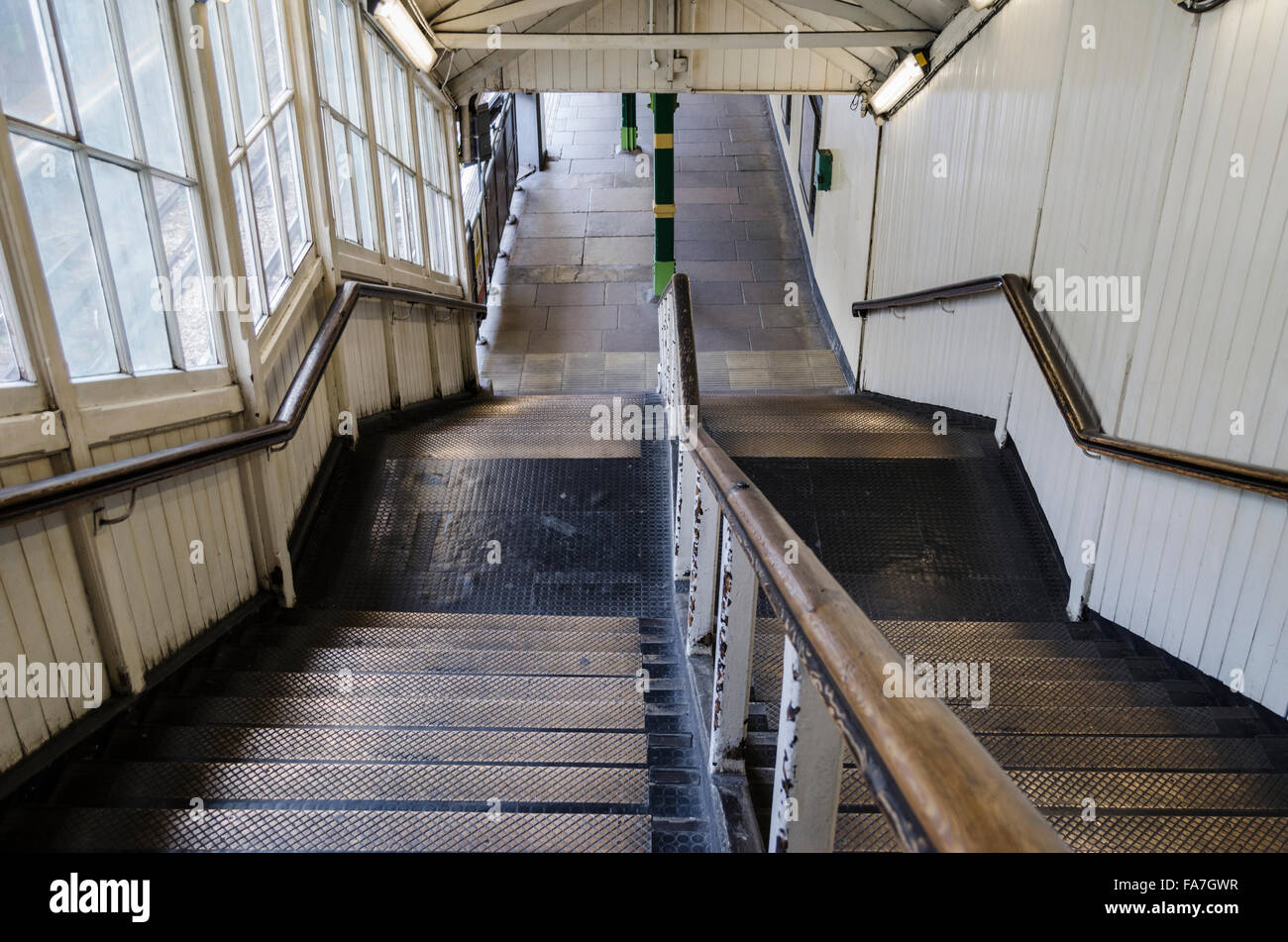 Stairway descending to an urban railway platform Stock Photo - Alamy