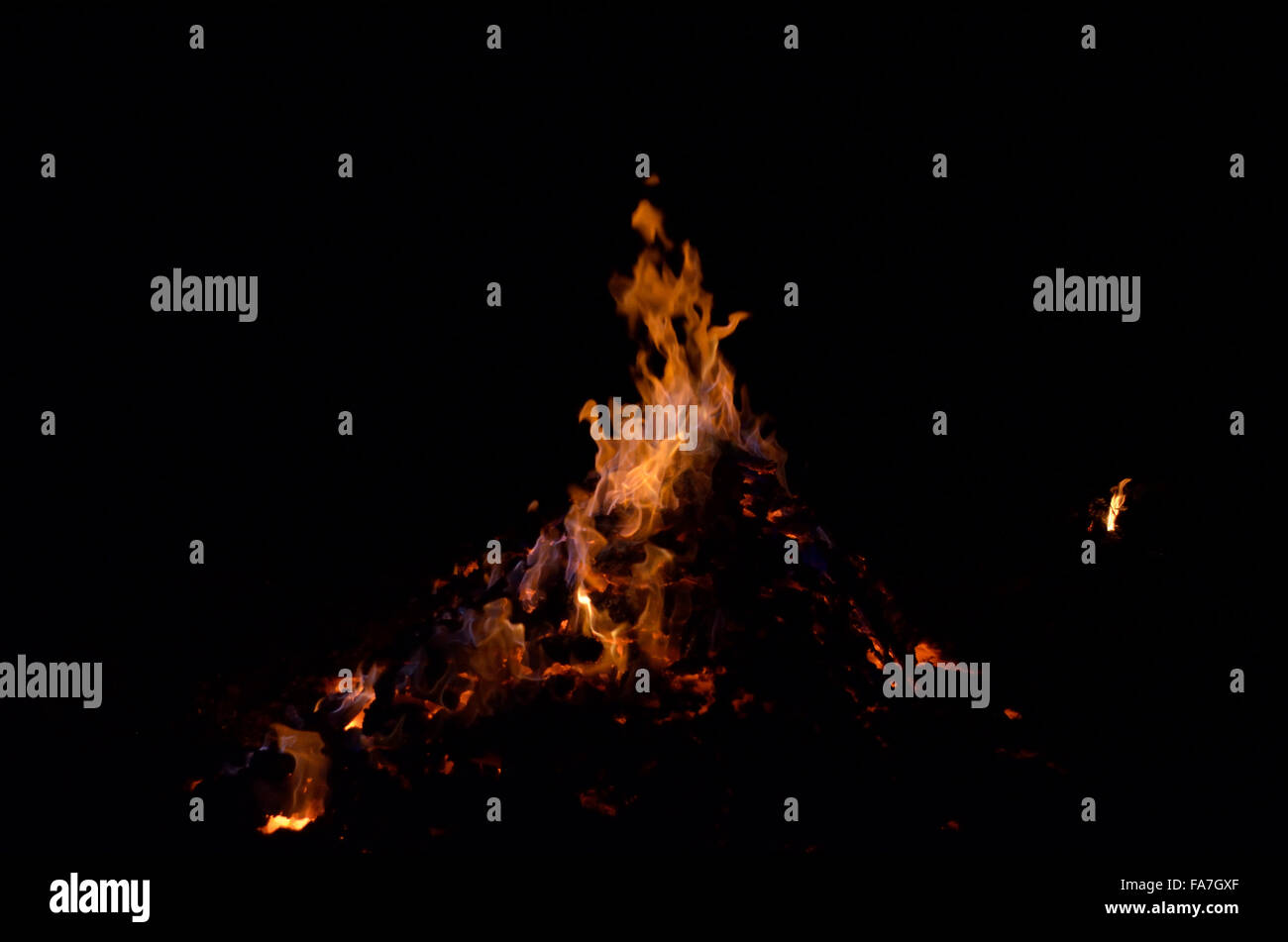 beautiful red hot glowing ember pile with colorful flames in winter ...