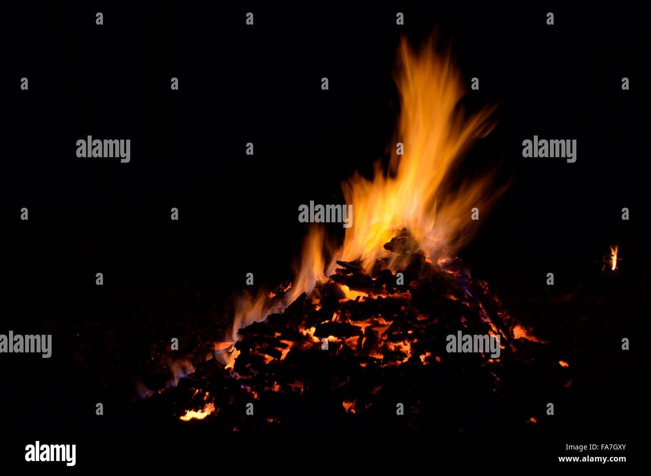 beautiful red hot glowing ember pile with colorful flames in winter ...