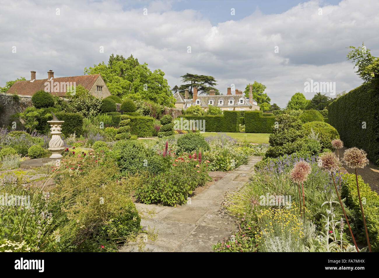 Sundial and topiary in front of Woolbeding House (not National Trust ...