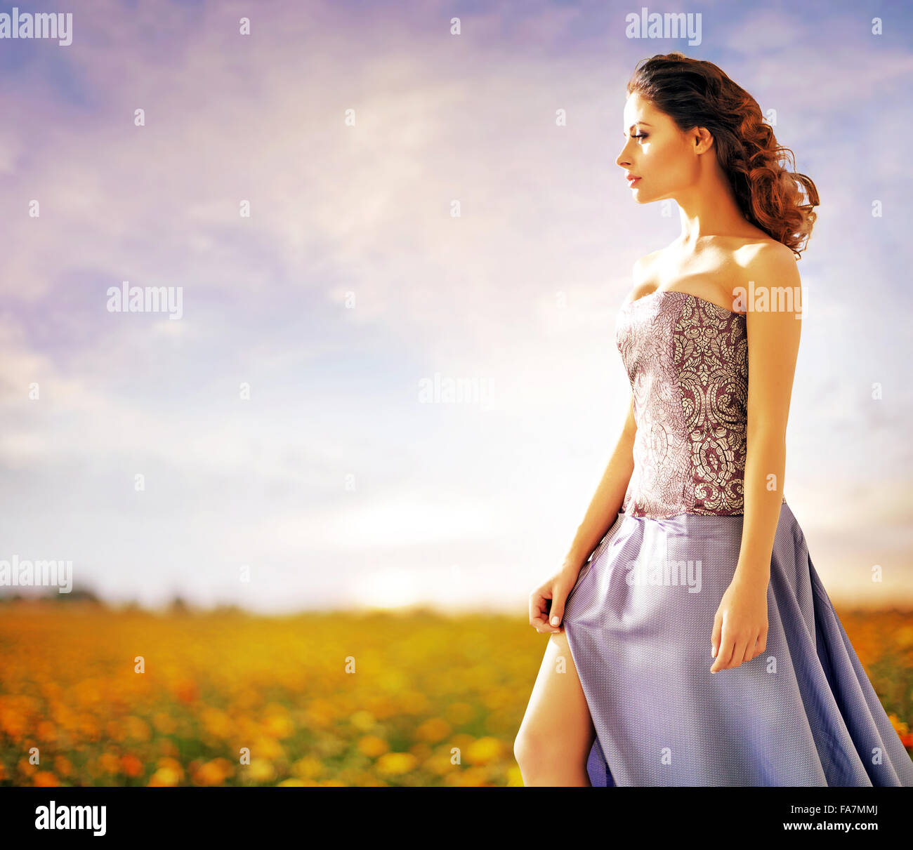 Pretty lady walking on the rural meadow Stock Photo - Alamy
