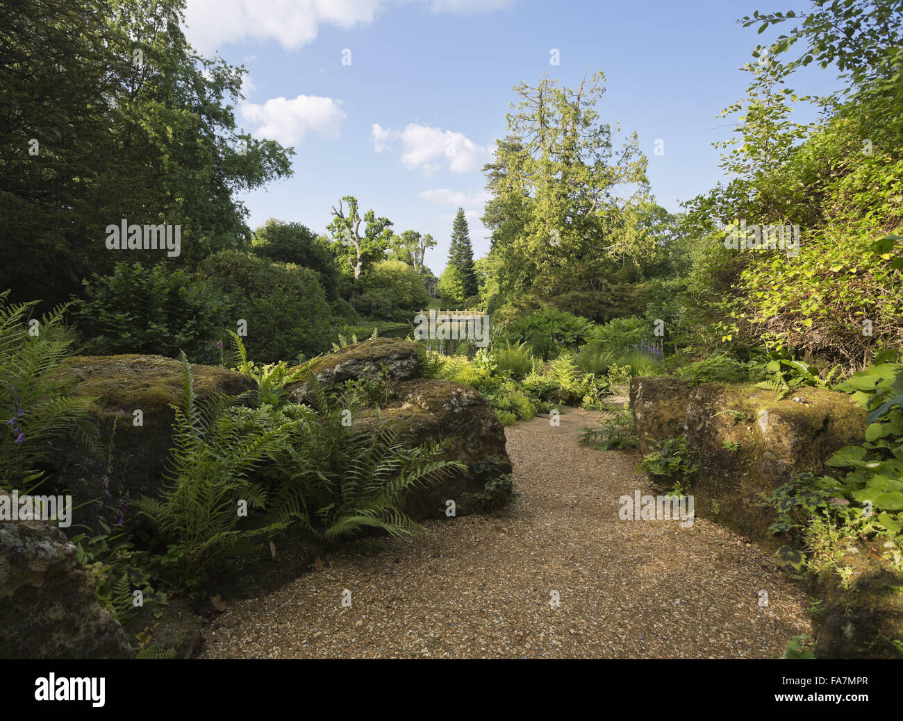 Evening light on the lake in the garden created by Simon Sainsbury and ...