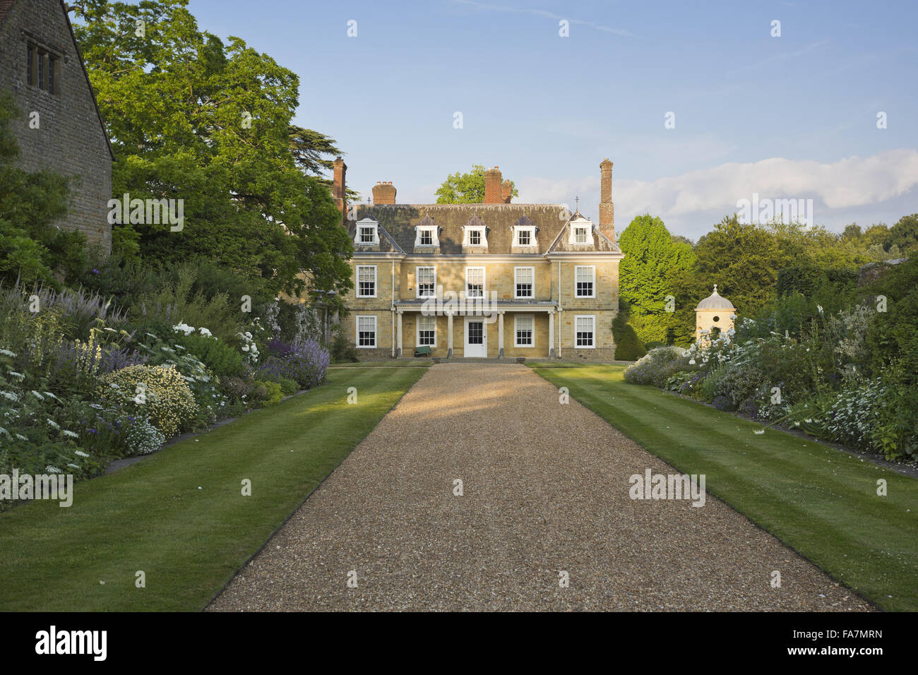 Evening light in July on the south front of Woolbeding House (not ...