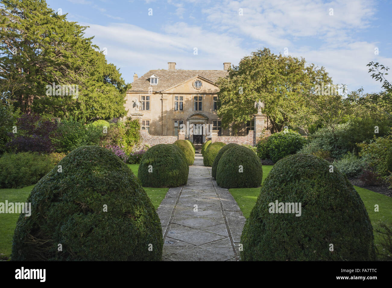 View along the stone path between box mounds to the west front of the ...