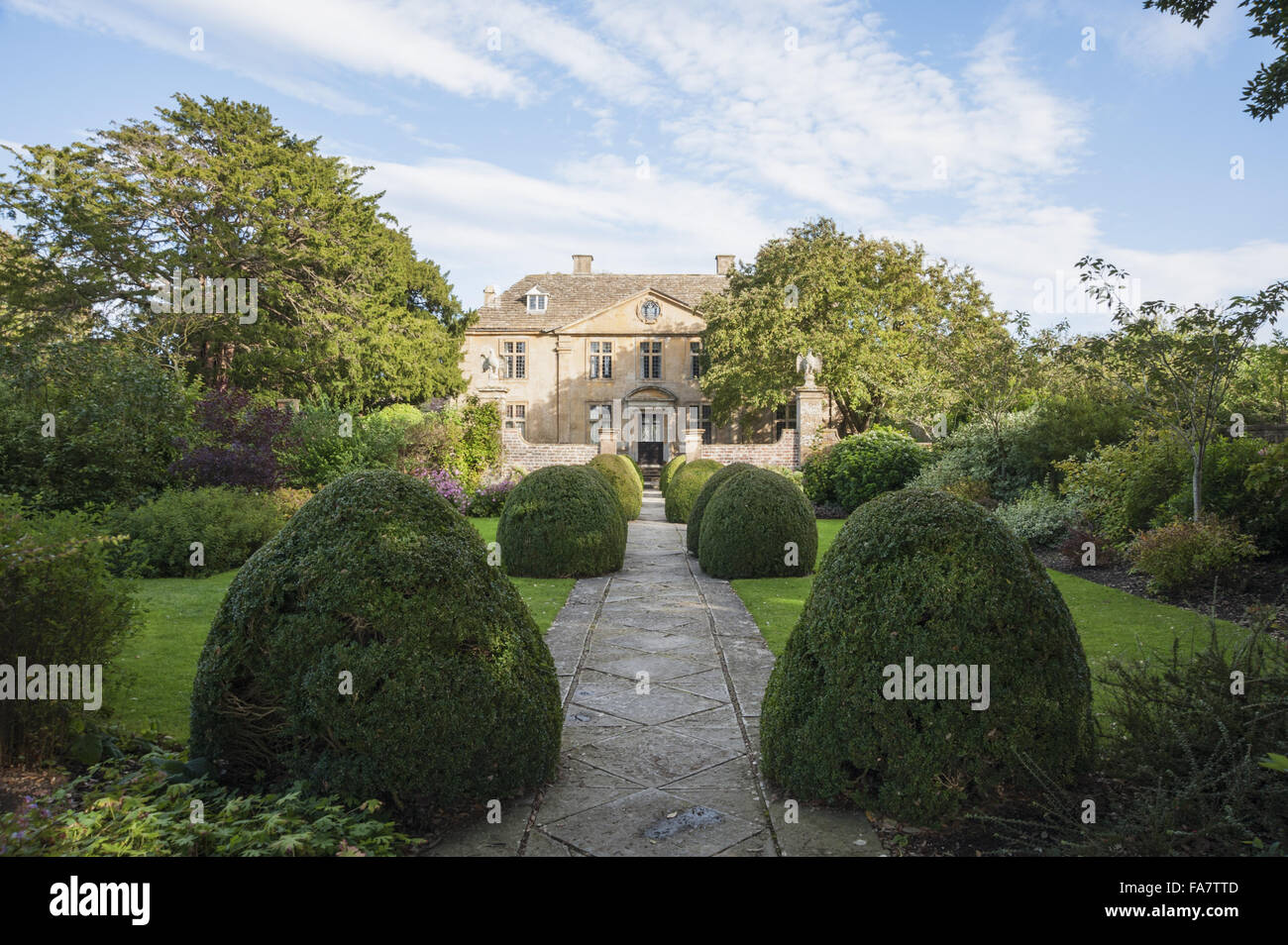 View along the stone path between box mounds to the west front of the ...