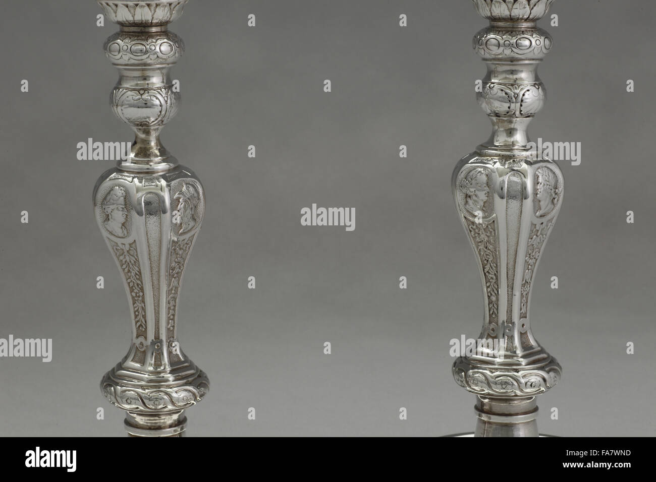 Detail of classical heads on a pair of candlesticks by Pierre Platel ...