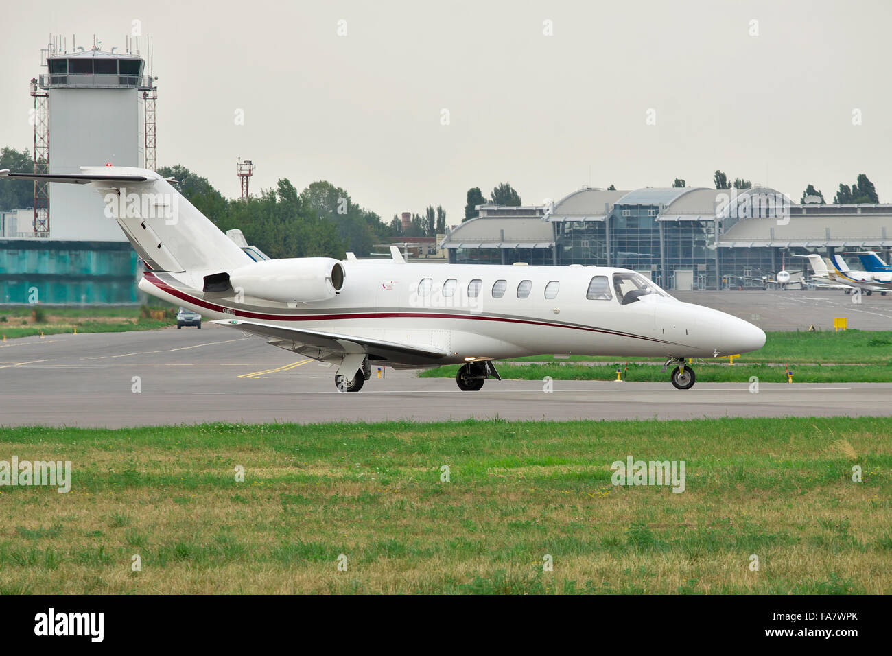 Private business jet plane on runway before takeoff Stock Photo - Alamy