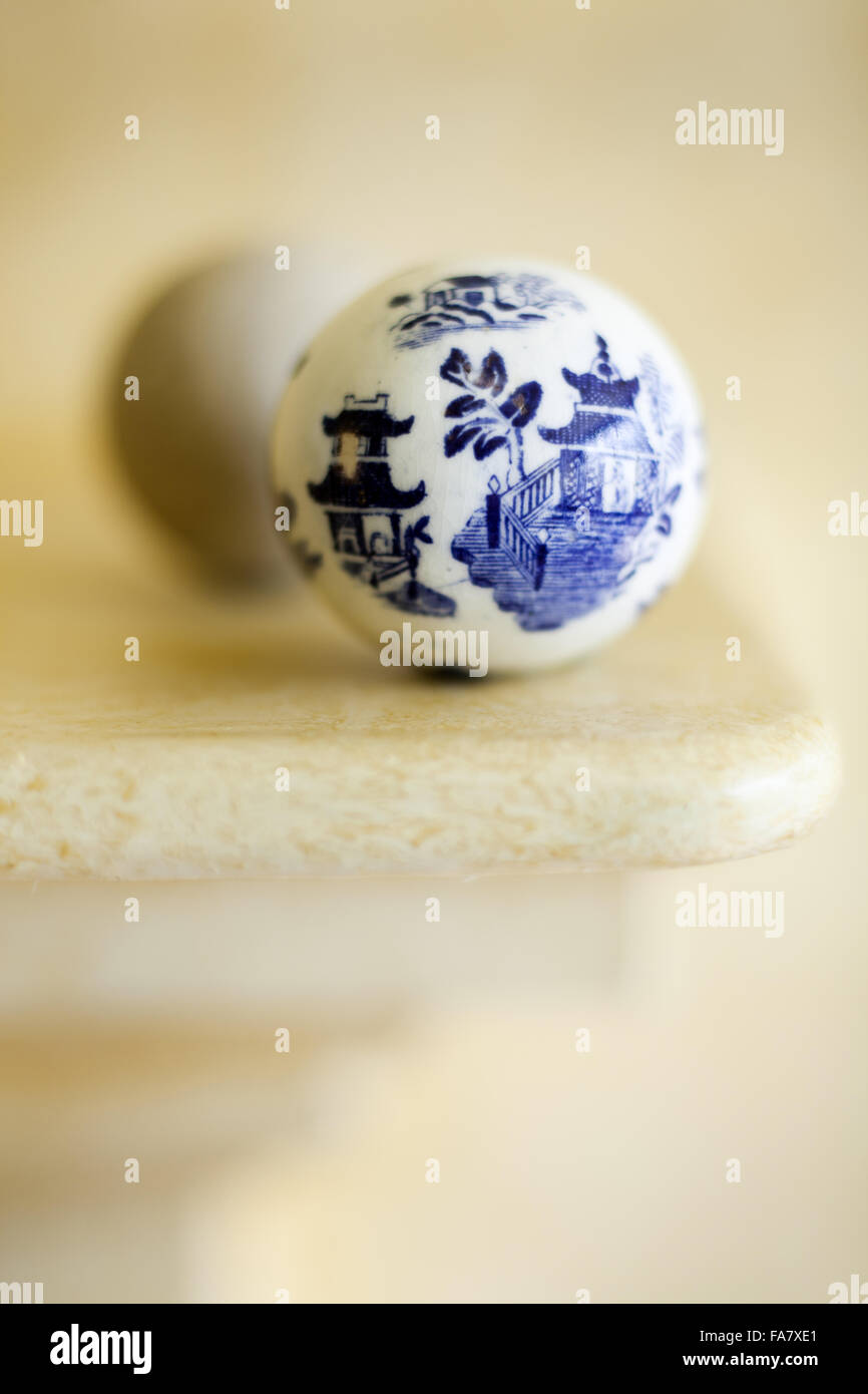 A blue and white Royal Worcester porcelain grinding ball, at Nuffield ...