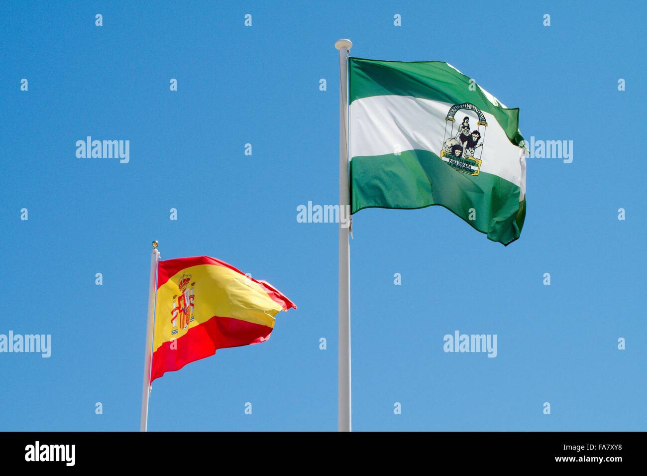 Spanish and Andalucian Flags on blue sky Stock Photo - Alamy