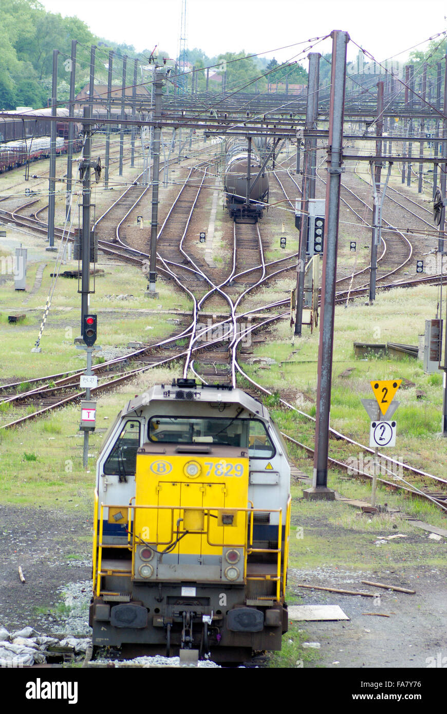 Yellow Locomotive and exchanger in perspective Stock Photo - Alamy