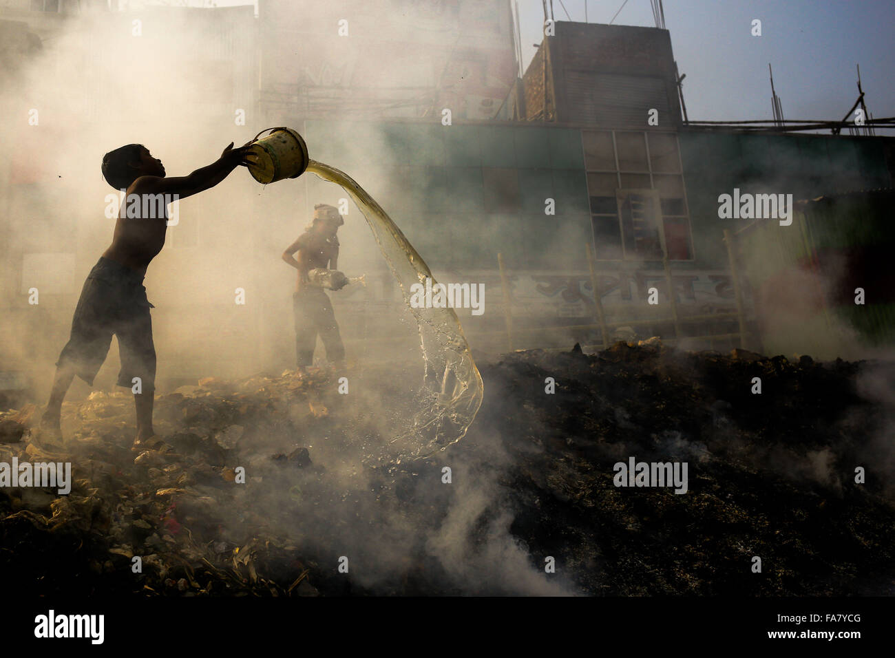 Dec. 23, 2015 - Dhaka, Bangladesh - People set fire in a garbage to ...