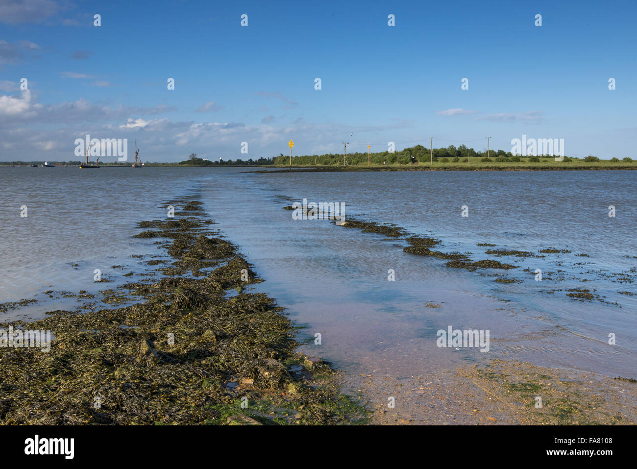 View of the partially submerged causeway across the Blackwater Estuary ...