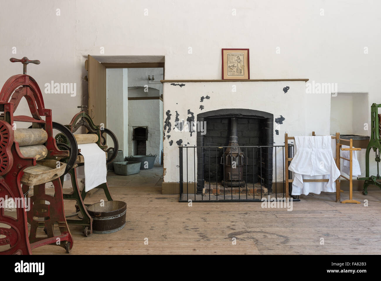 Fireplace, mangles and clothes dryers in the Laundry at Killerton ...