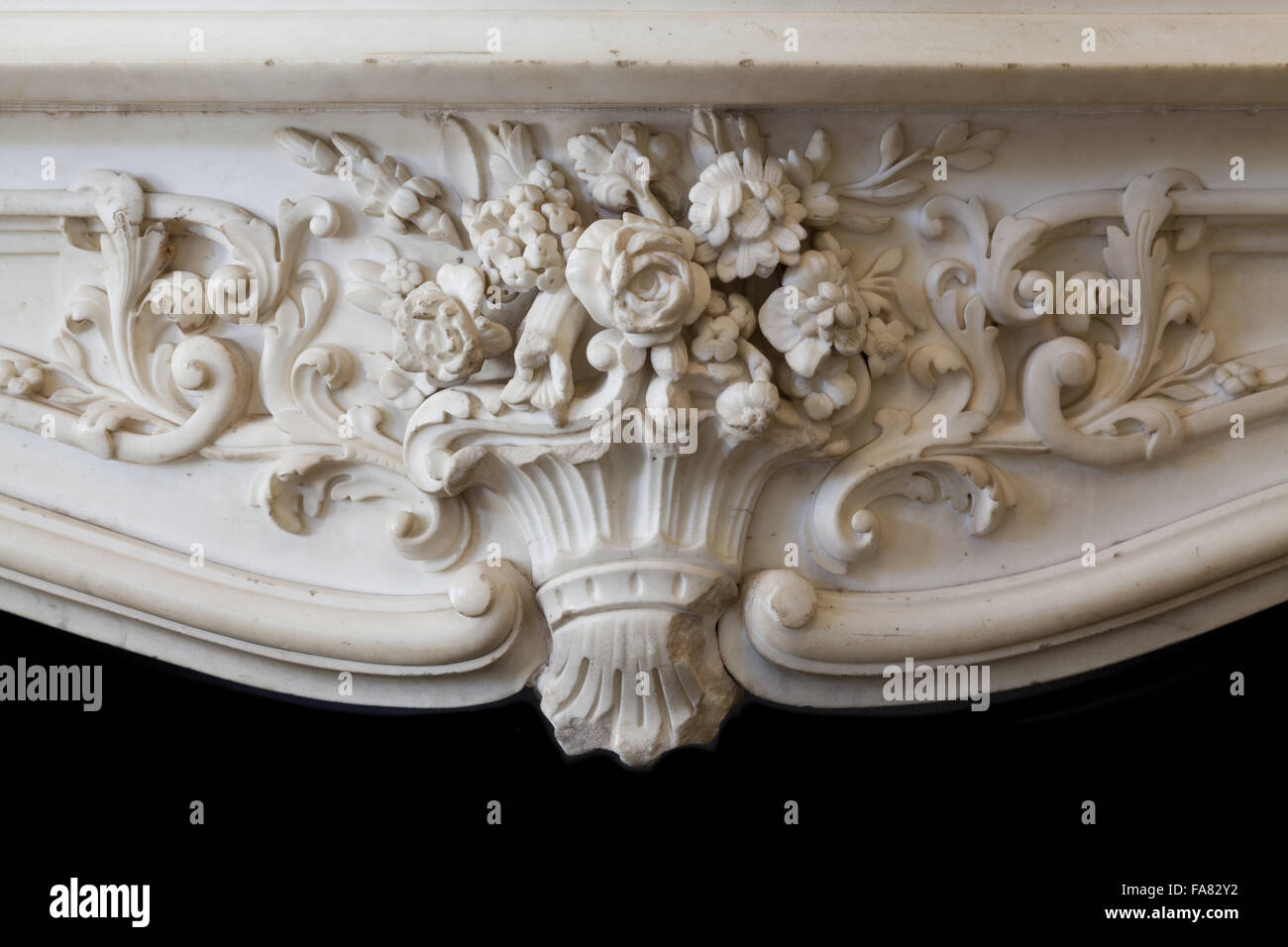 Detail of the ornate marble fireplace in the Music Room at Killerton ...