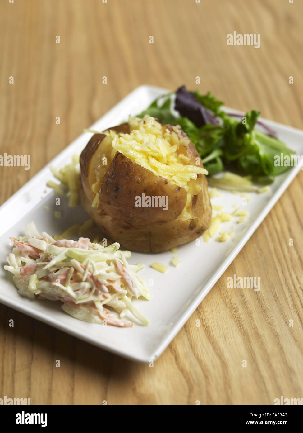 Jacket potato with cheese and coleslaw hi-res stock photography and ...