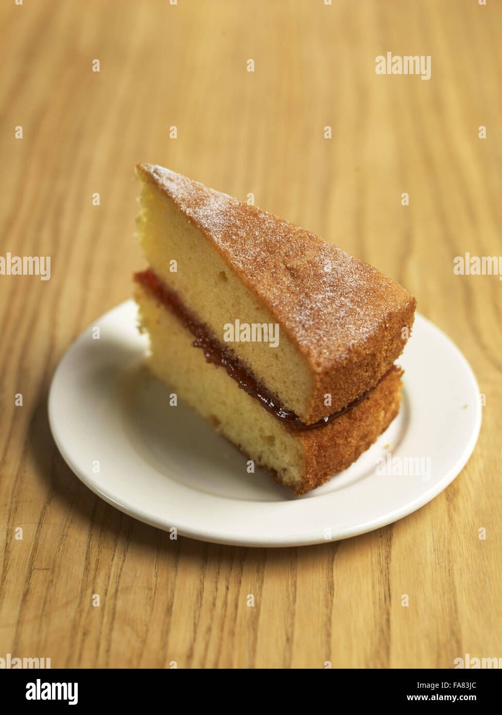Slice of Victoria sandwich sponge cake Stock Photo - Alamy