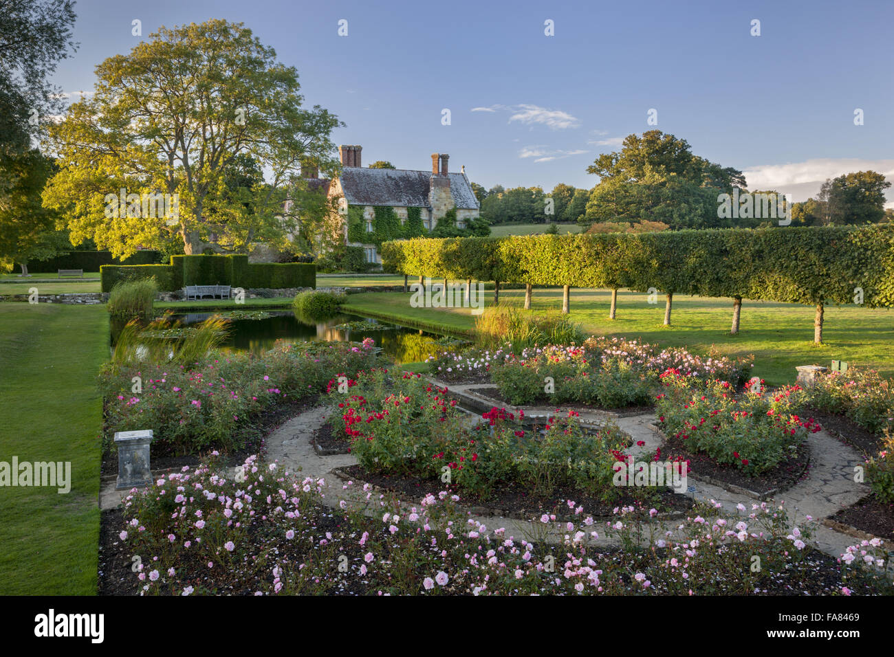 The rose garden and pond at Bateman's, East Sussex. Bateman's was the ...