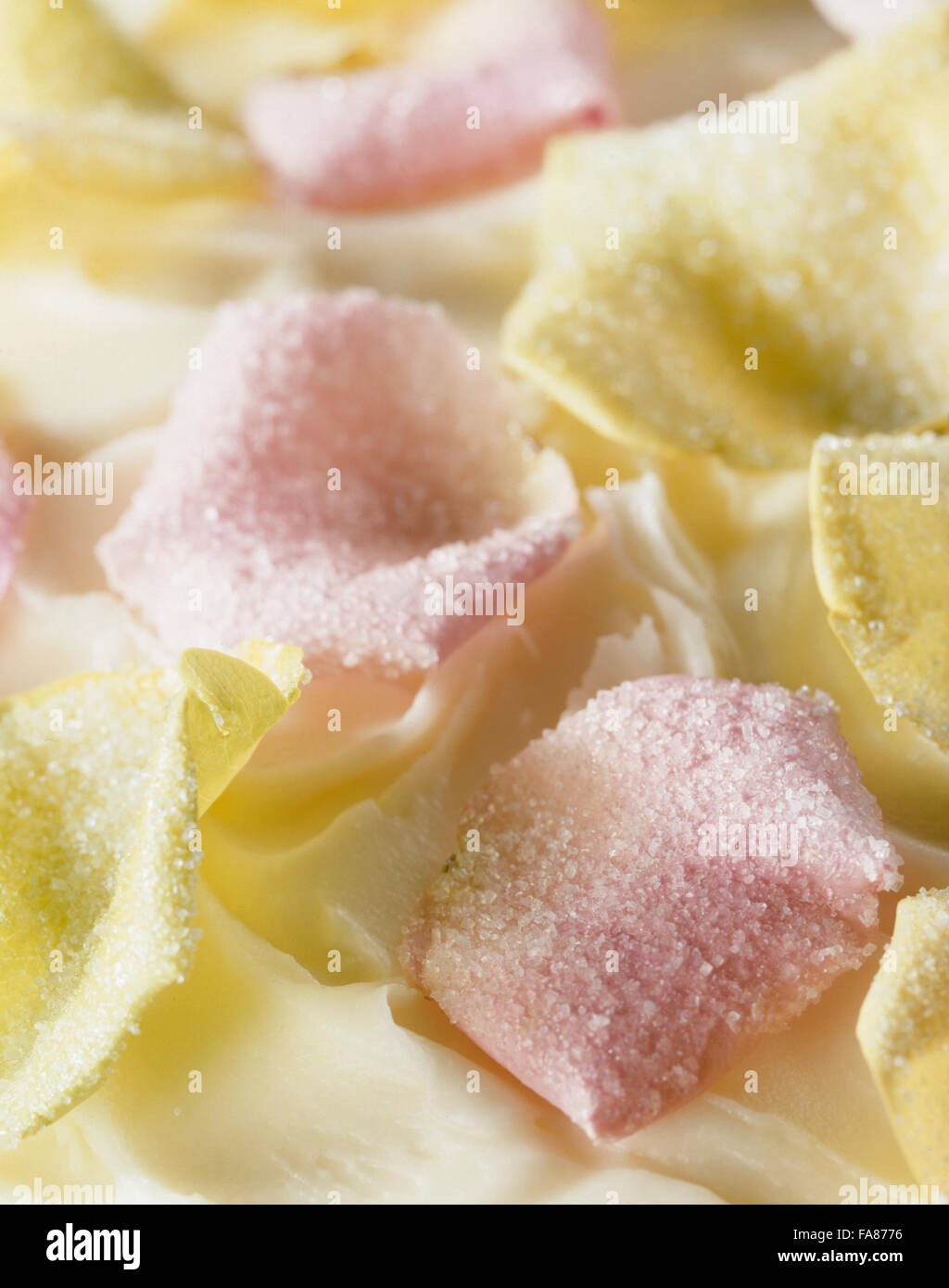 Pink and yellow sugar coated rose petals Stock Photo - Alamy