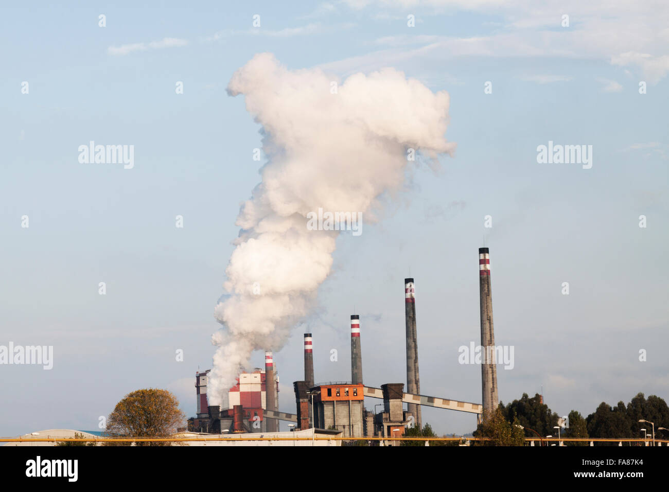 a horizontal view of some smoking pipes of an industry plant Stock ...